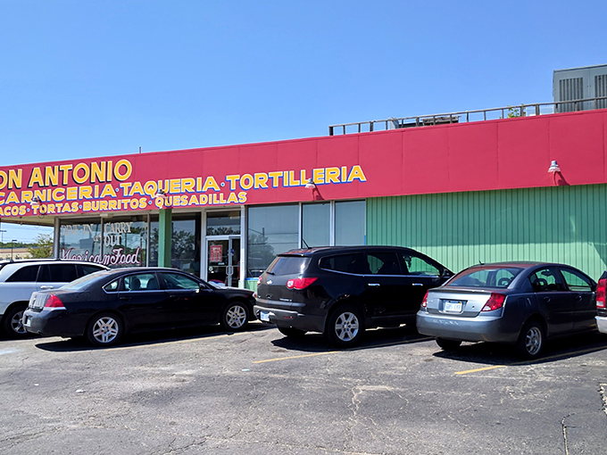 The yellow and red sign doesn't whisper, it announces: "Authentic Mexican food happens here!" No fancy marketing needed when the tacos speak for themselves.