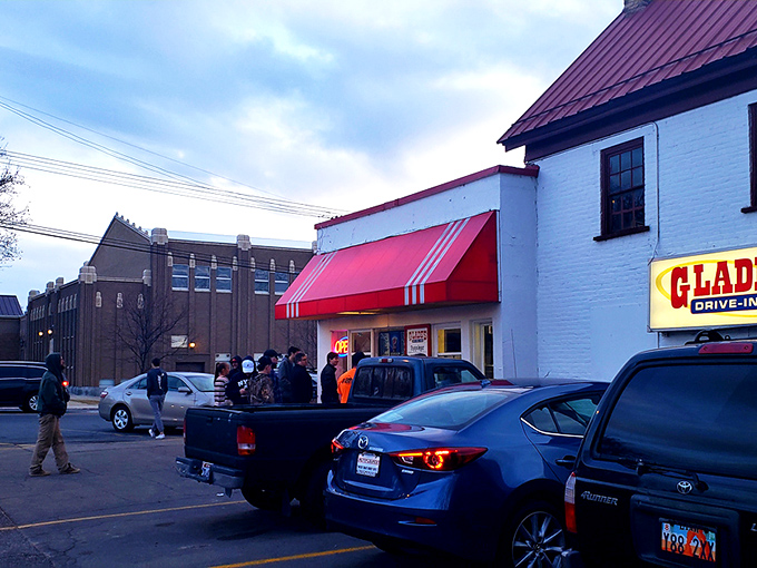 The classic red and white exterior of Glade's stands like a time capsule on Spanish Fork's corner, beckoning hungry travelers with nostalgic charm.