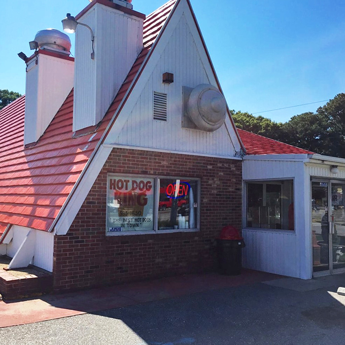 The iconic sign of Gus's Hot Dog King stands like a beacon of comfort food against the Virginia sky, promising Hormel hot dogs and memories in equal measure.