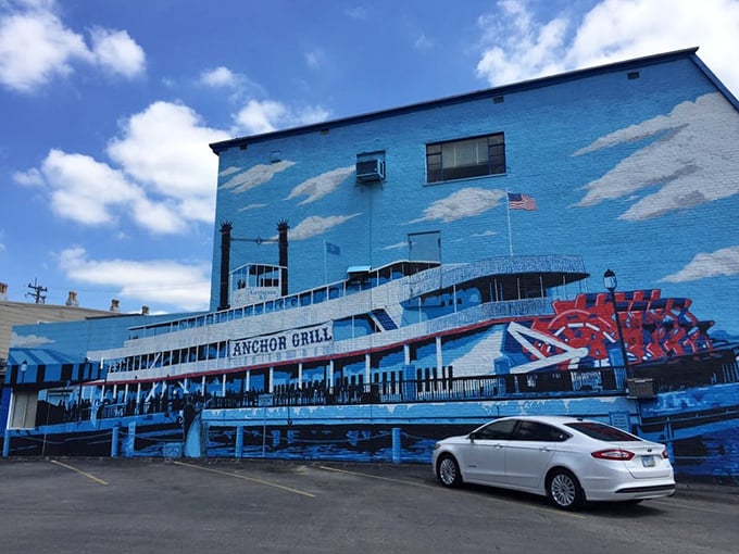 The blue-painted exterior of Anchor Grill features a stunning steamboat mural that's like a maritime welcome committee for hungry travelers.