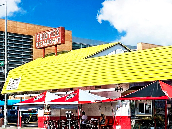 The iconic red-and-white facade of Frontier Restaurant stands as Albuquerque's culinary lighthouse, beckoning hungry souls from Central Avenue.