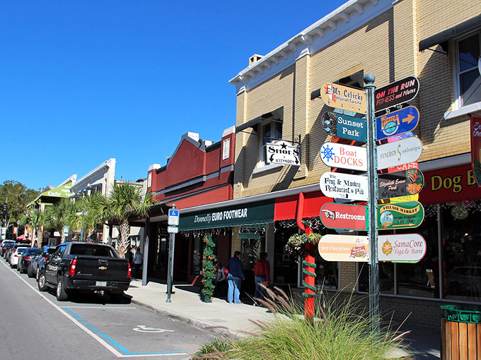 Historic brick buildings line Mount Dora's main street, where palm trees and vintage architecture create that perfect "Old Florida meets small-town charm" vibe.