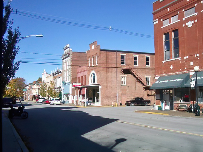 Historic charm meets small-town serenity on New Harmony's Main Street, where brick buildings whisper stories of utopian dreams and antique treasures await.