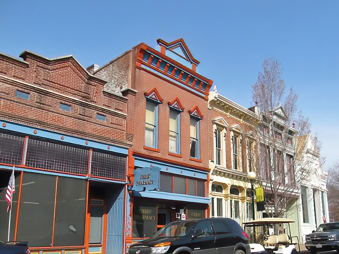 Historic charm meets small-town serenity on New Harmony's Main Street, where brick buildings whisper stories of utopian dreams and antique treasures await.