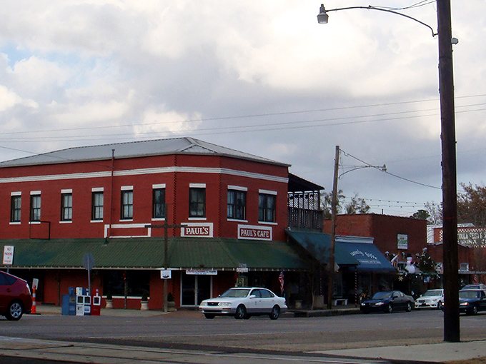 Paul's Caf&eacute; anchors the corner of Ponchatoula's historic downtown, where string lights create an everyday celebration atmosphere along brick-paved streets.