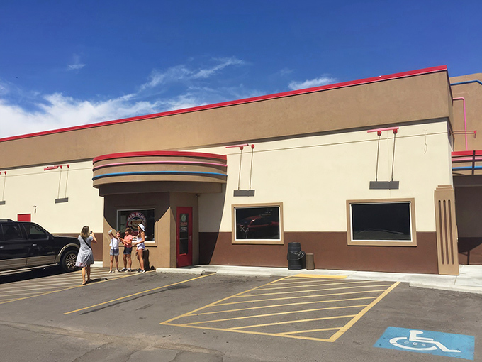 Big Jud's Art Deco-inspired exterior stands like a time machine to burger paradise, complete with that iconic pink trim that says "serious comfort food inside." 