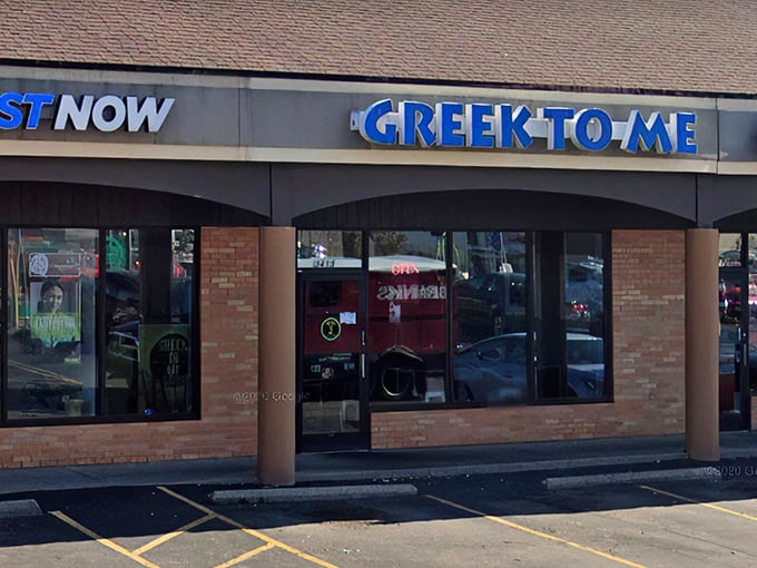 The bright blue sign beckons like a Mediterranean lighthouse in a sea of strip mall sameness. Kentucky's answer to Athens awaits inside.