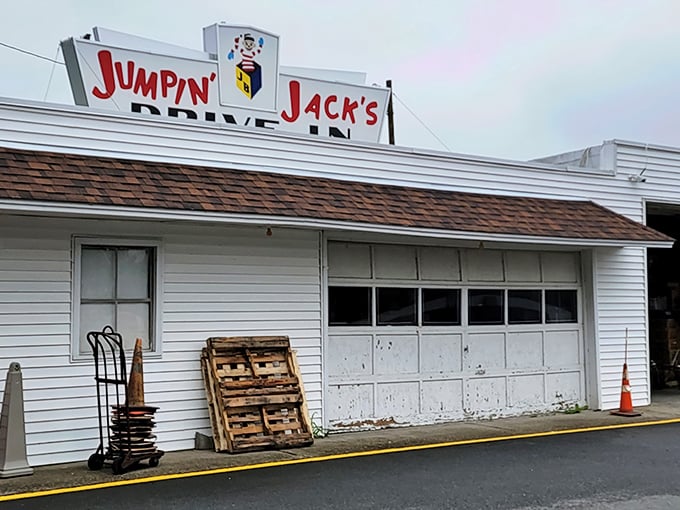 The iconic Jumpin' Jack's sign stands proudly against dramatic skies, while Old Glory waves from a fire truck ladder&mdash;a Scotia summer tradition in full swing.