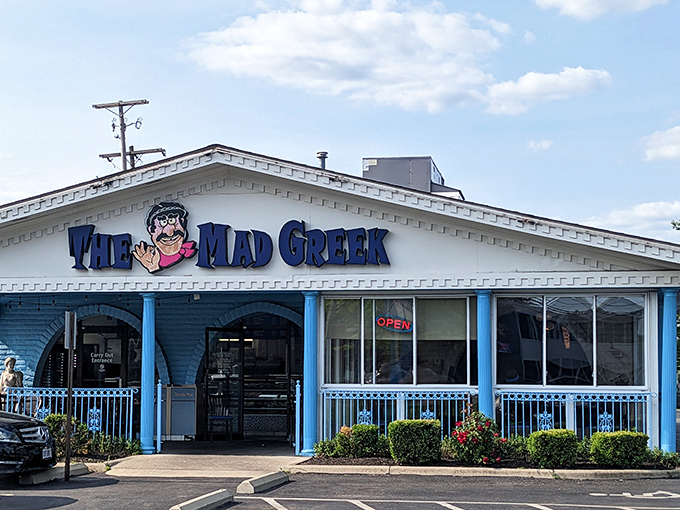The blue-trimmed facade of The Mad Greek stands like a cheerful Santorini postcard dropped into Columbus. Greek hospitality awaits! 