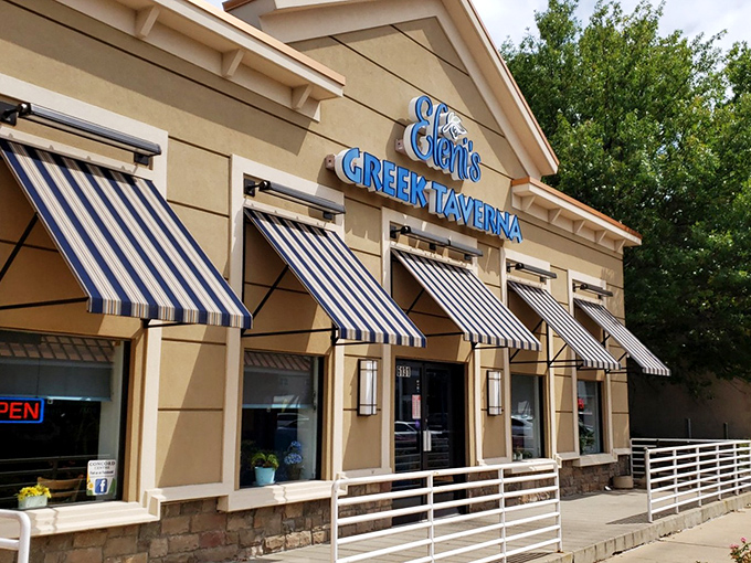 The blue sign of Eleni's Greek Taverna glows like a Mediterranean beacon in Springfield, promising authentic flavors that'll make you forget you're in Virginia.