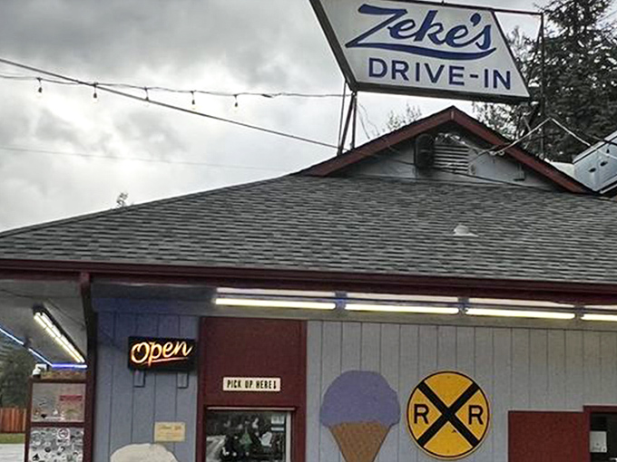 Simplicity at its finest: The iconic blue and white Zeke's sign beckons hungry travelers like a lighthouse for those navigating the sea of Highway 2 hunger pangs.