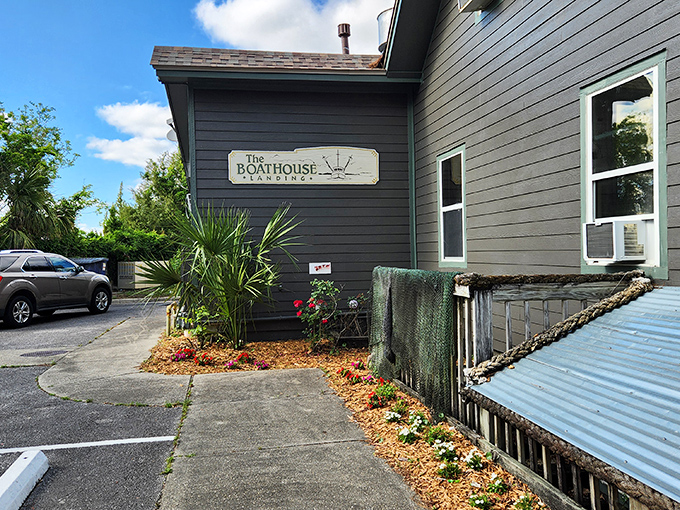 The unassuming gray exterior of The Boathouse Landing might fool you, but locals know this weathered facade hides culinary treasures worth discovering.