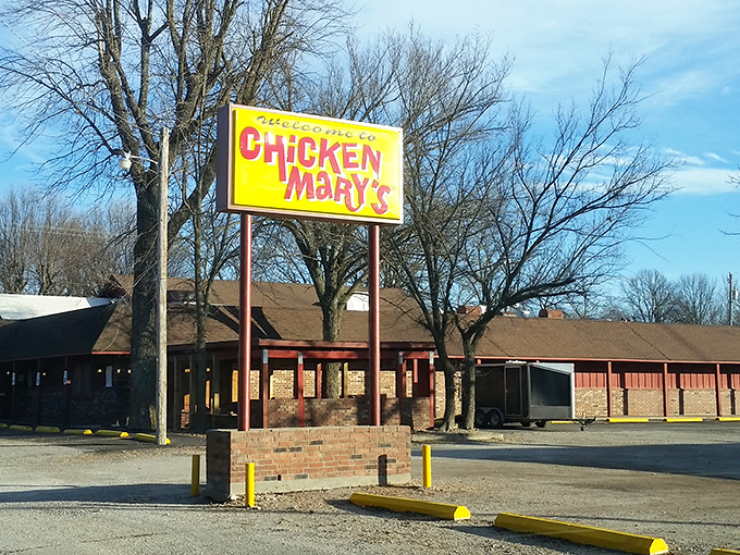 The bright yellow sign stands like a beacon of fried chicken hope on the Kansas horizon. Culinary pilgrims, your destination awaits.