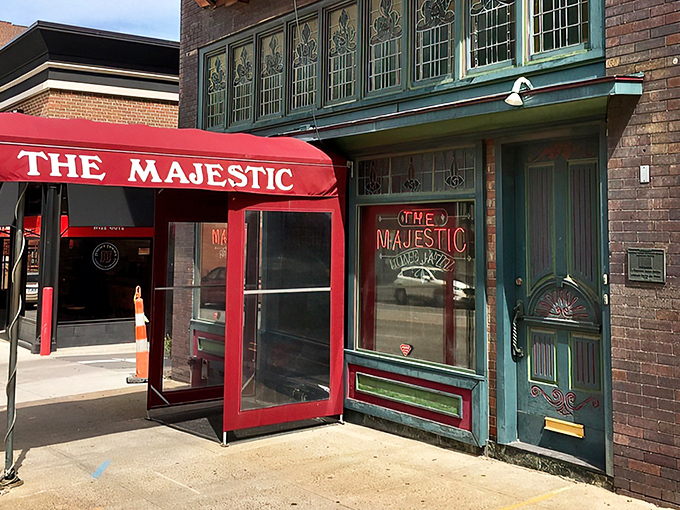 The crimson awning of The Majestic beckons like a time portal to the Prohibition era. History and hunger, satisfied under one historic roof.