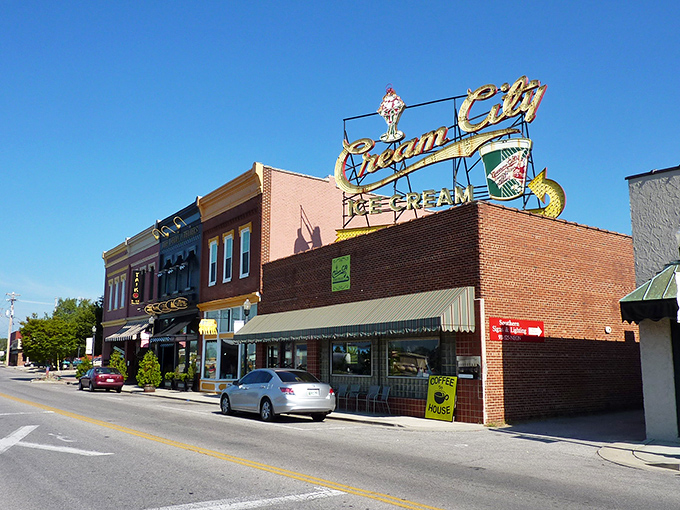 Historic storefronts with classic blue awnings create that perfect small-town ambiance where your dollar stretches further than your weekend plans. 