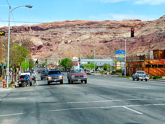 Main Street Moab, where pickup trucks are the fashion statement and those red rock backdrops aren't painted&mdash;Mother Nature just showing off.