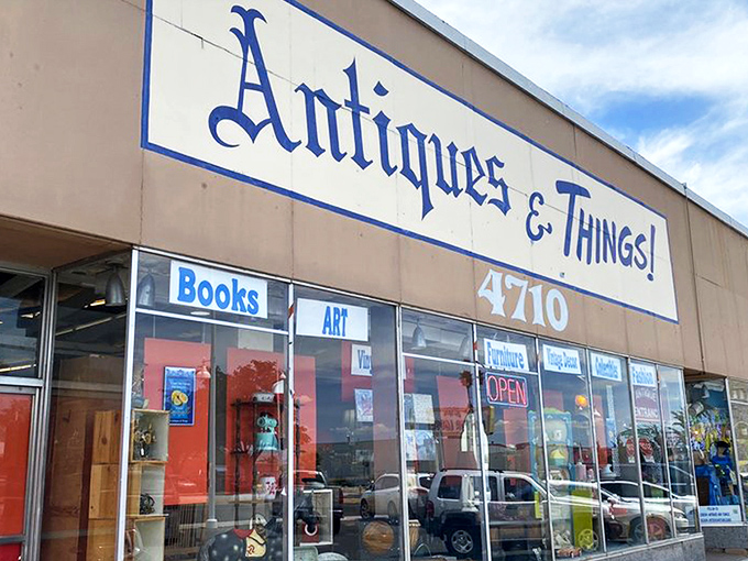 The storefront beckons with promises of treasures within, its blue lettering against beige like a desert sky invitation to explore.