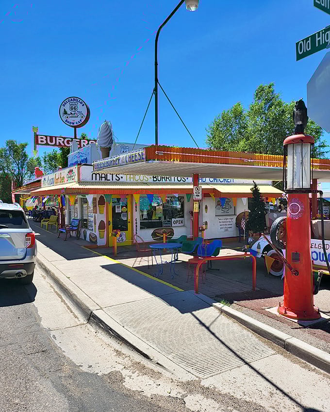 Route 66 nostalgia meets carnival funhouse at Delgadillo's Snow Cap, where even the vintage car out front refuses to take itself seriously.