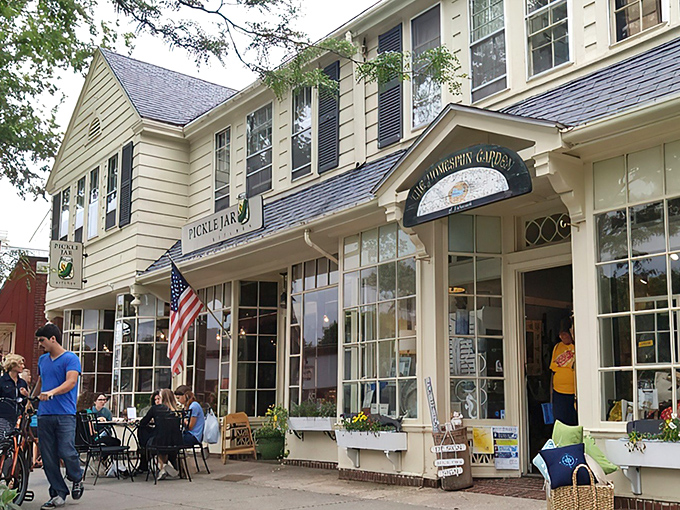 The charming yellow exterior of Pickle Jar Kitchen beckons like a culinary lighthouse on Falmouth's Main Street, promising comfort and creativity inside.
