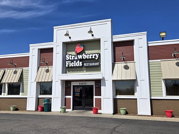 The white facade with its cheerful strawberry logo promises comfort food with a side of Beatles nostalgia. A culinary Yellow Submarine awaits!