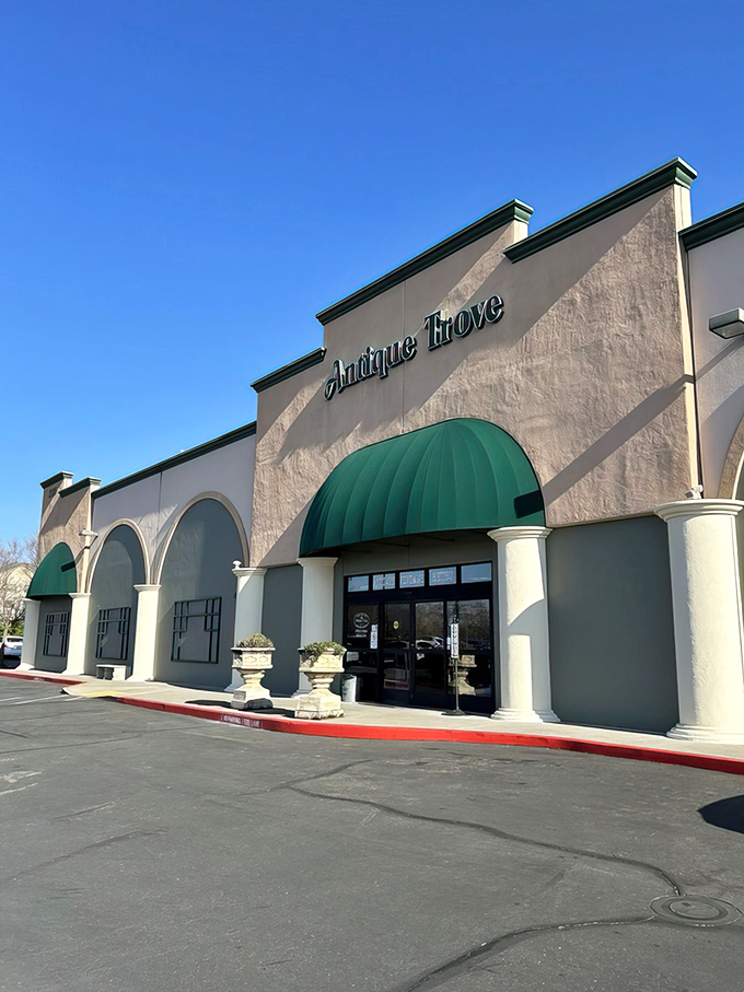 The stately fa&ccedil;ade of Antique Trove beckons with its elegant green awnings, promising treasures within that IKEA could never dream of offering.