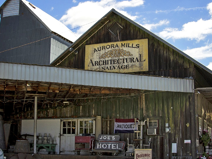 The rustic barn exterior of Aurora Mills beckons like a siren song to vintage lovers. Halloween cobwebs add seasonal charm to this already magical treasure trove.