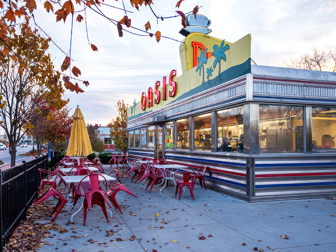 The sunshine-yellow exterior of Oasis Diner beckons like a time portal to the 1950s, complete with palm trees that seem hilariously optimistic in Indiana weather.