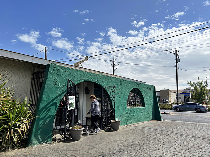 The turquoise exterior of Scotts Diner stands out like a culinary oasis in Merced, beckoning hungry travelers with its charming retro vibe.