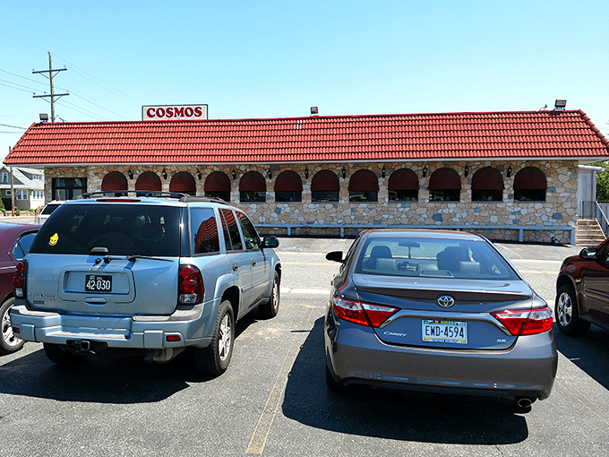 The distinctive red roof and stone facade of Cosmos Restaurant & Bar stands as a Wilmington landmark, promising Greek-American comfort food that delivers on nostalgia and flavor.
