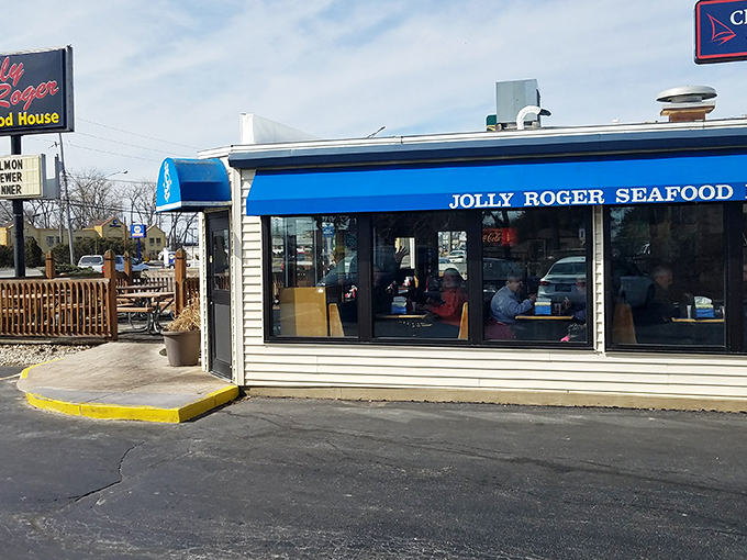 The iconic blue awning of Jolly Roger Seafood House stands as a beacon for seafood pilgrims. Like a coastal mirage in Port Clinton, it promises treasures from the deep.