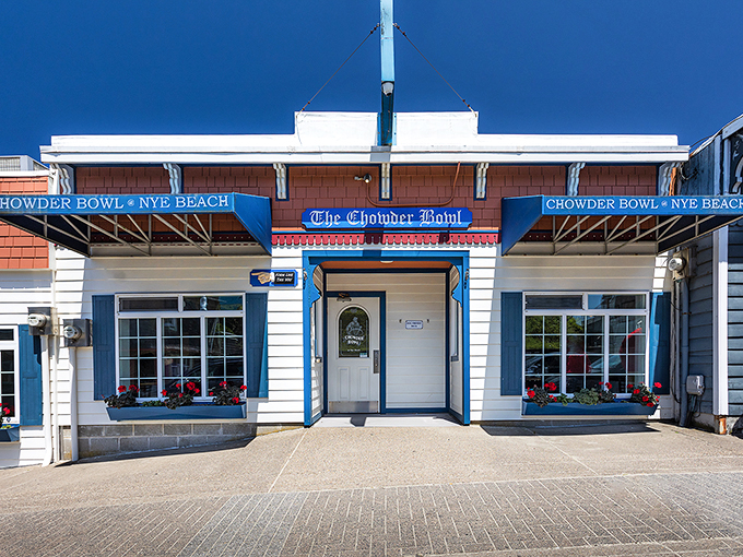 The classic coastal charm of The Chowder Bowl beckons like an old friend, its blue-trimmed facade promising seafood salvation after a long drive.