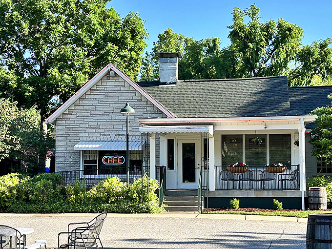 The humble stone facade of Loveless Cafe stands like a time capsule of Southern hospitality, promising comfort food treasures within its welcoming porch.