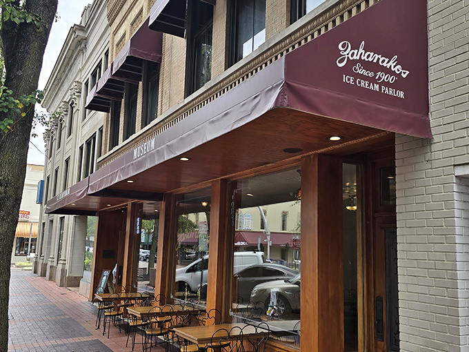 Step back in time with Zaharakos' stunning wooden fa&ccedil;ade &ndash; where the red awnings aren't just decorative, they're practically inviting you in for a sweet escape.