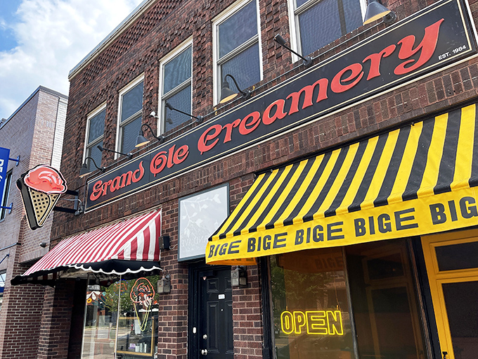 The iconic brick fa&ccedil;ade of Grand Ole Creamery, with its vintage striped awnings and neon ice cream cone sign, beckons sweet-toothed pilgrims from across Minnesota.