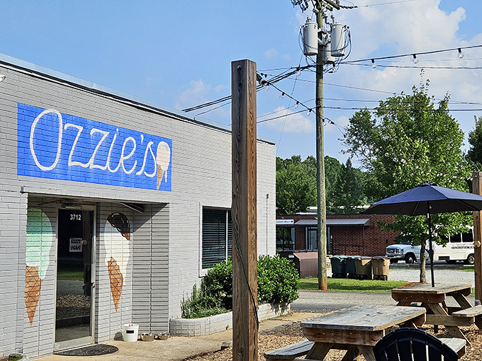 The brilliant blue sign of Ozzie's against white brick is like a beacon for ice cream lovers&mdash;simplicity that promises sweet perfection inside.