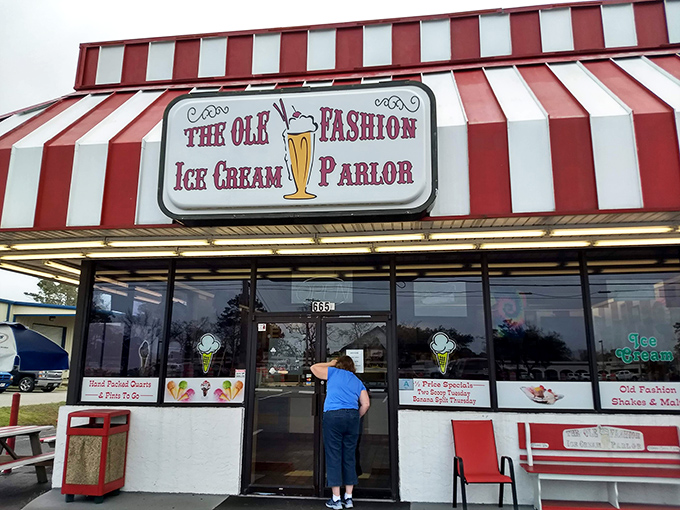 The red and white striped awning isn't just eye-catching&mdash;it's the universal signal that serious ice cream happiness awaits inside. No filter needed on this classic Americana.