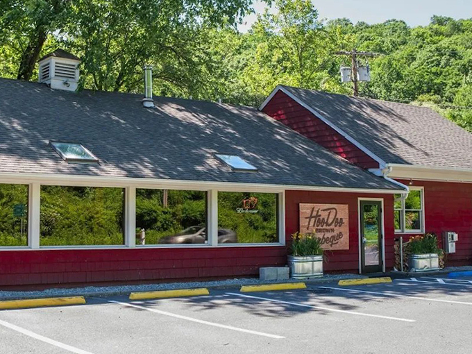 The unassuming red exterior hides barbecue greatness like Clark Kent's glasses hide Superman. The sign is your beacon to smoky paradise.