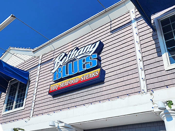 The coastal charm of Bethany Blues' exterior promises what lies within&mdash;a temple of smoke where beach vibes meet barbecue brilliance.