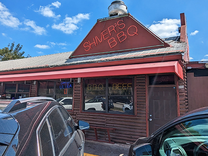 The log cabin exterior with its bright red trim stands like a delicious mirage in Homestead, promising smoky treasures within. Florida's answer to barbecue paradise.