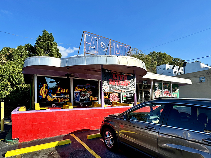 That neon glow isn't just lighting up the night—it's a beacon calling hungry souls to barbecue salvation on Piedmont Avenue.