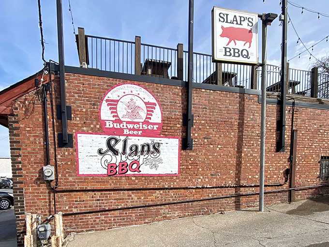The brick exterior of Slap's BBQ stands like a temple to smoked meat, promising delicious secrets within its unassuming walls.