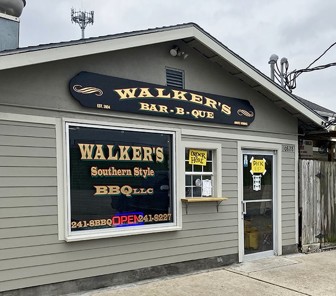 Walker's BBQ stands like a smoke-scented beacon of hope for hungry travelers. That massive smoker isn't just equipment&mdash;it's a declaration of serious barbecue intentions.