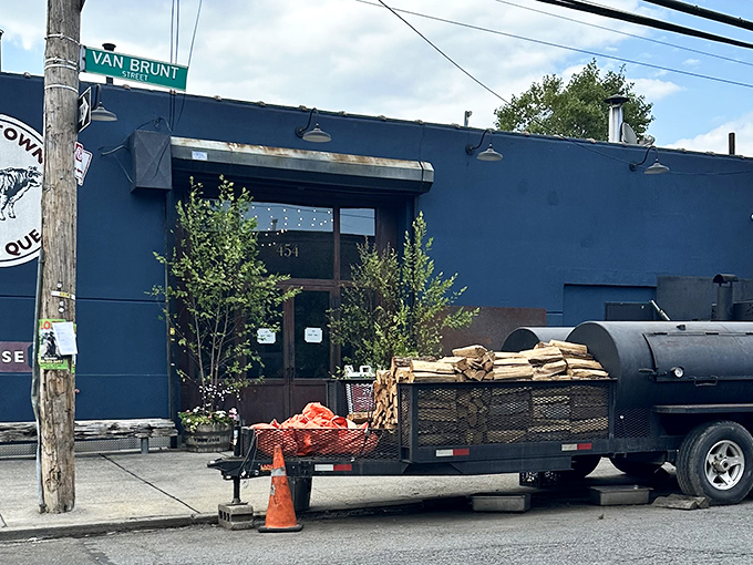 The blue exterior with its vintage cow logo isn't just a restaurant front&mdash;it's a beacon of smoke-scented hope for barbecue pilgrims seeking meaty salvation. 