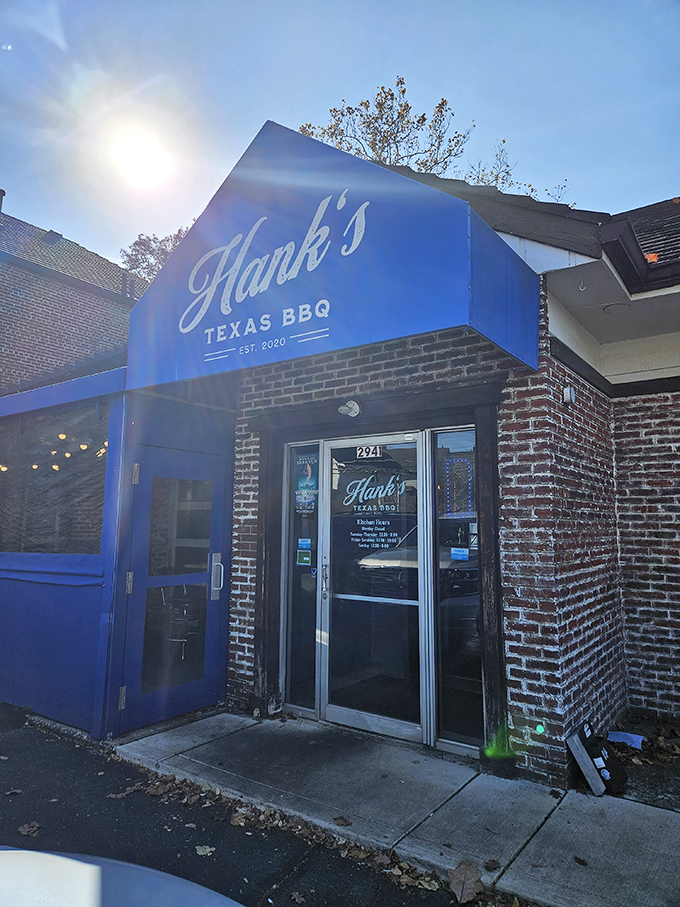 The blue awning of Hank's Texas BBQ beckons like a smoke signal to hungry Columbus residents. BBQ paradise hides in plain sight.