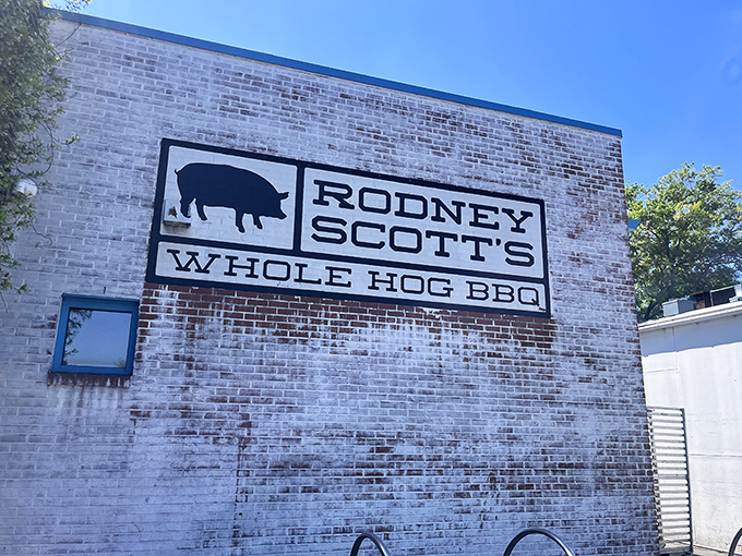 The unmistakable white brick and turquoise trim of barbecue paradise. Rodney Scott's exterior promises the smoky delights waiting inside.