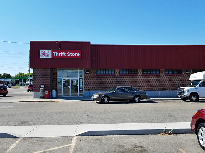 The iconic red exterior of Idaho Youth Ranch Thrift Store stands as a beacon of bargain-hunting possibilities in Meridian.
