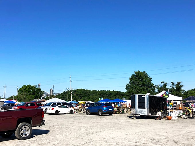 The treasure hunt begins in this unassuming gravel lot, where pickup trucks and sedans gather like prospectors at a modern-day gold rush.