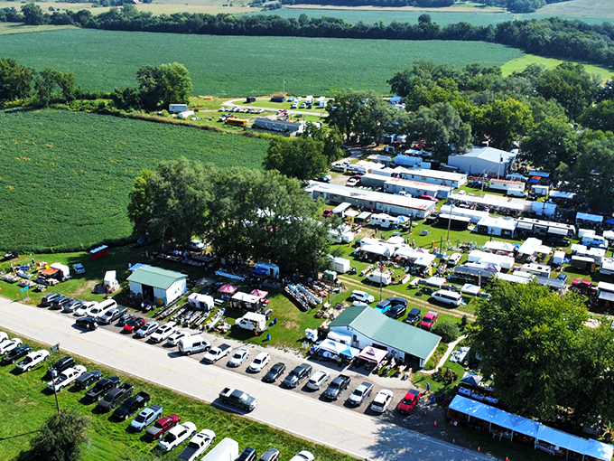 Treasure hunters navigate the grassy pathways between vendor stalls, where yesterday's castoffs await their second chance at usefulness and beauty.
