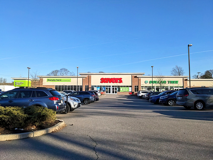 The iconic red Savers sign beckons like a lighthouse for bargain hunters, promising treasures waiting just beyond those sliding glass doors.