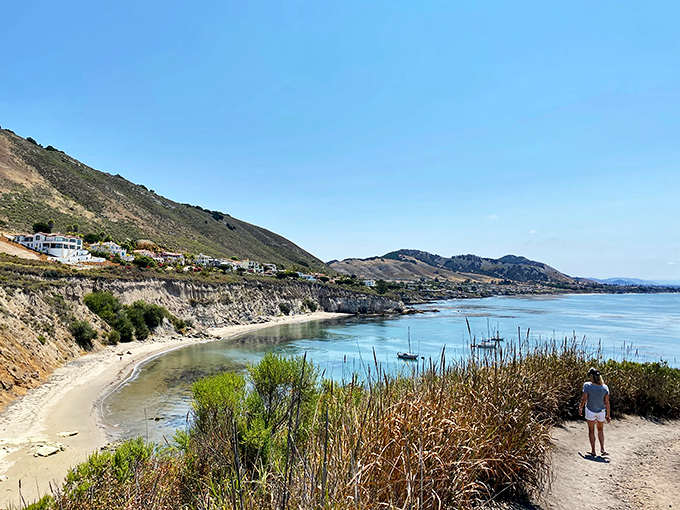 Nature's perfect viewpoint! The trail reveals Pirate's Cove below, where that impossibly blue water meets golden sand in a California dream come true.